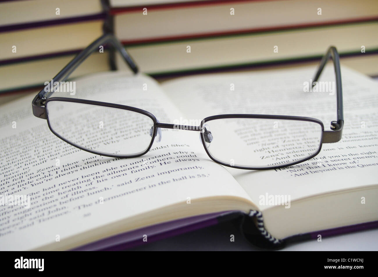 book and reading glasses Stock Photo - Alamy