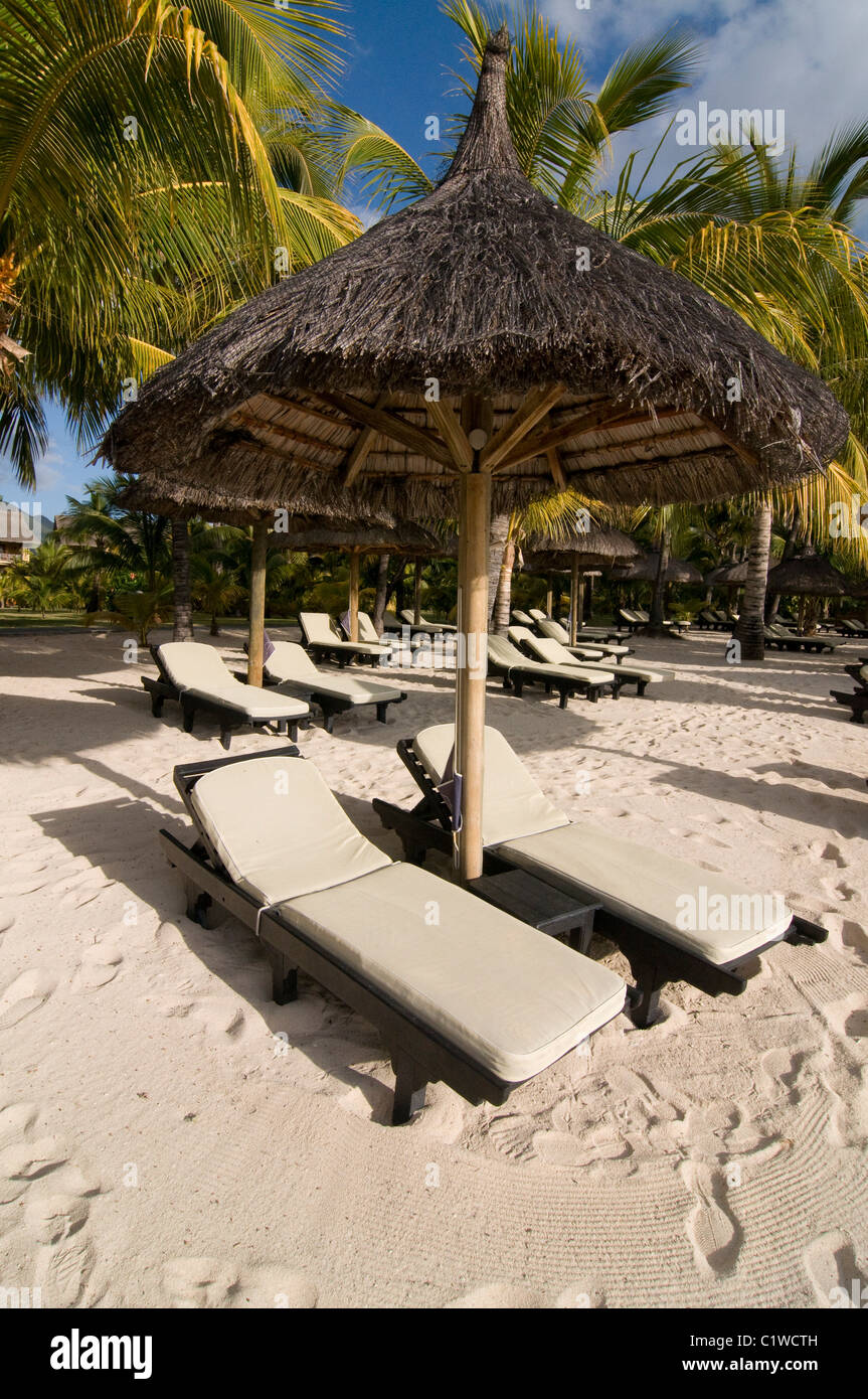 Mauritius, Le Paradis hotel, sun longers under sunshade at sandy beach ...