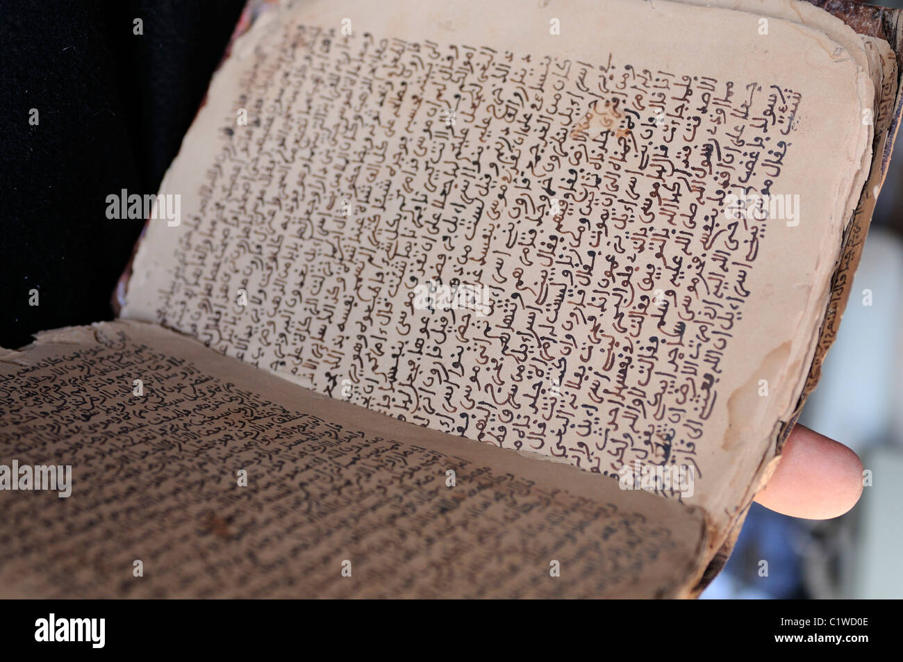 Mauritania, Ouadane, man holding old manuscripts of holy Koran Stock ...