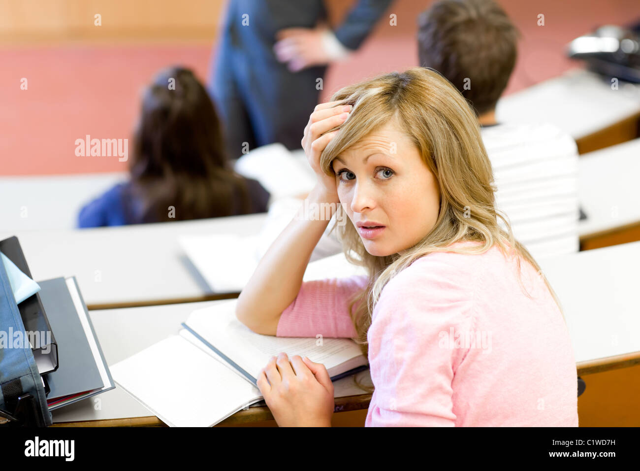 Portrait of a bored female student during a university lesson Stock ...