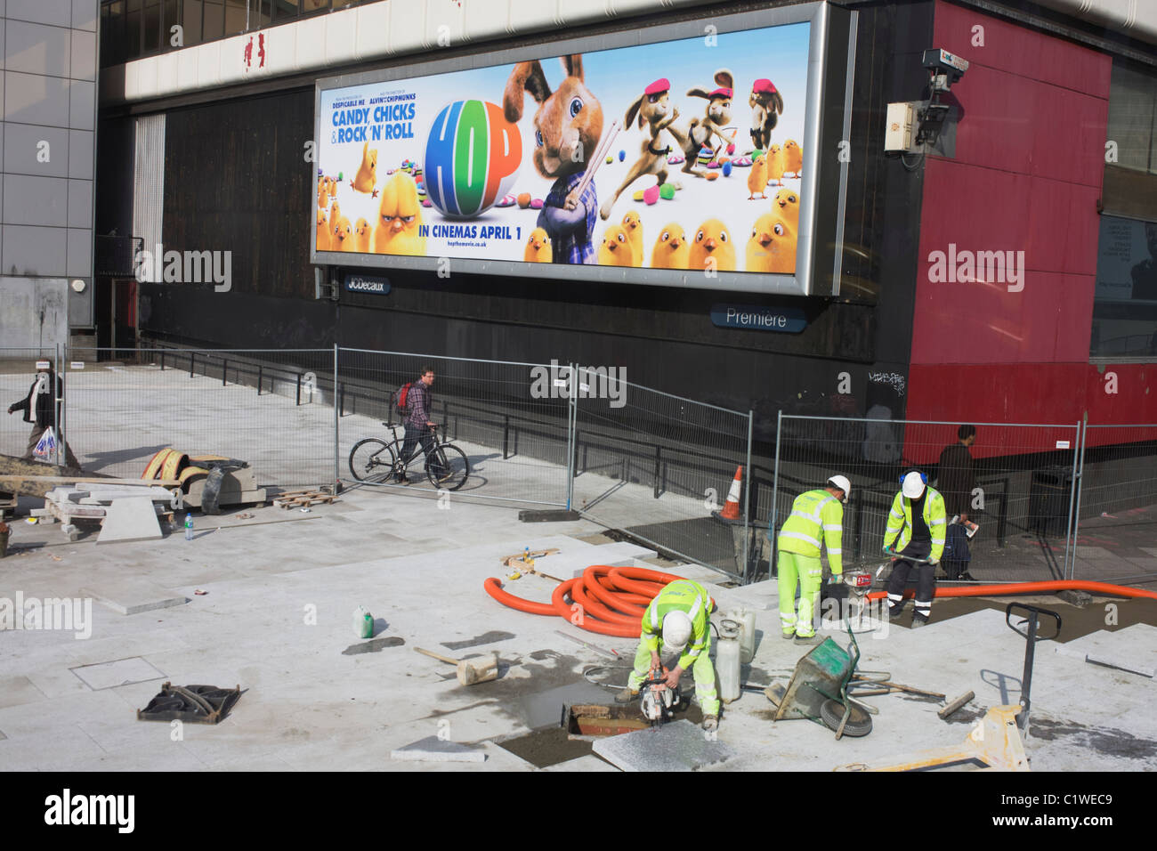Workmen put the finishing touches to a new pavement project below a ...
