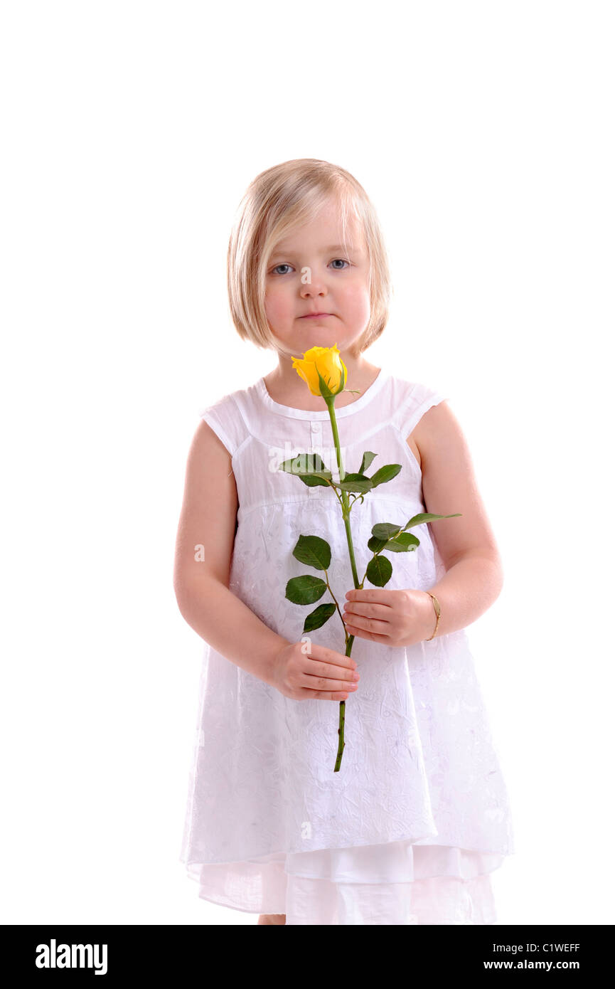 little girl with yellow rose. isolated on white Stock Photo - Alamy