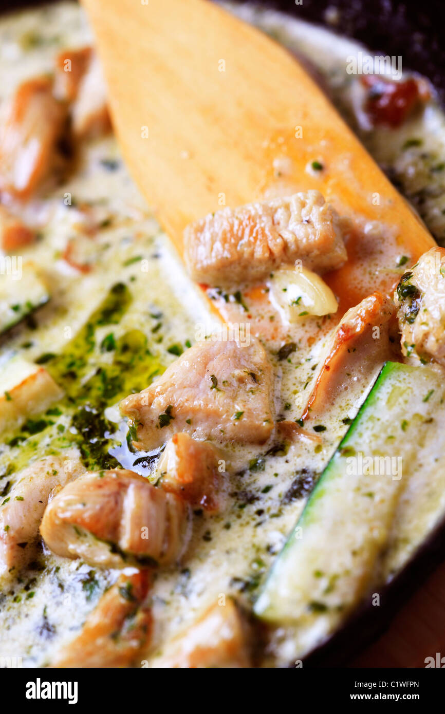 Chicken meat and courgette in cream sauce - detail Stock Photo - Alamy