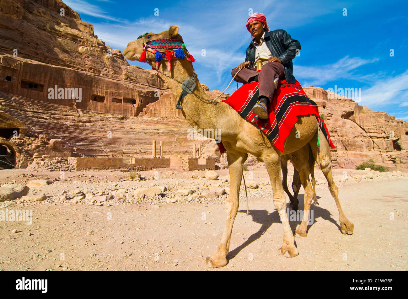 Jordan, Petra, Man riding camel Stock Photo - Alamy