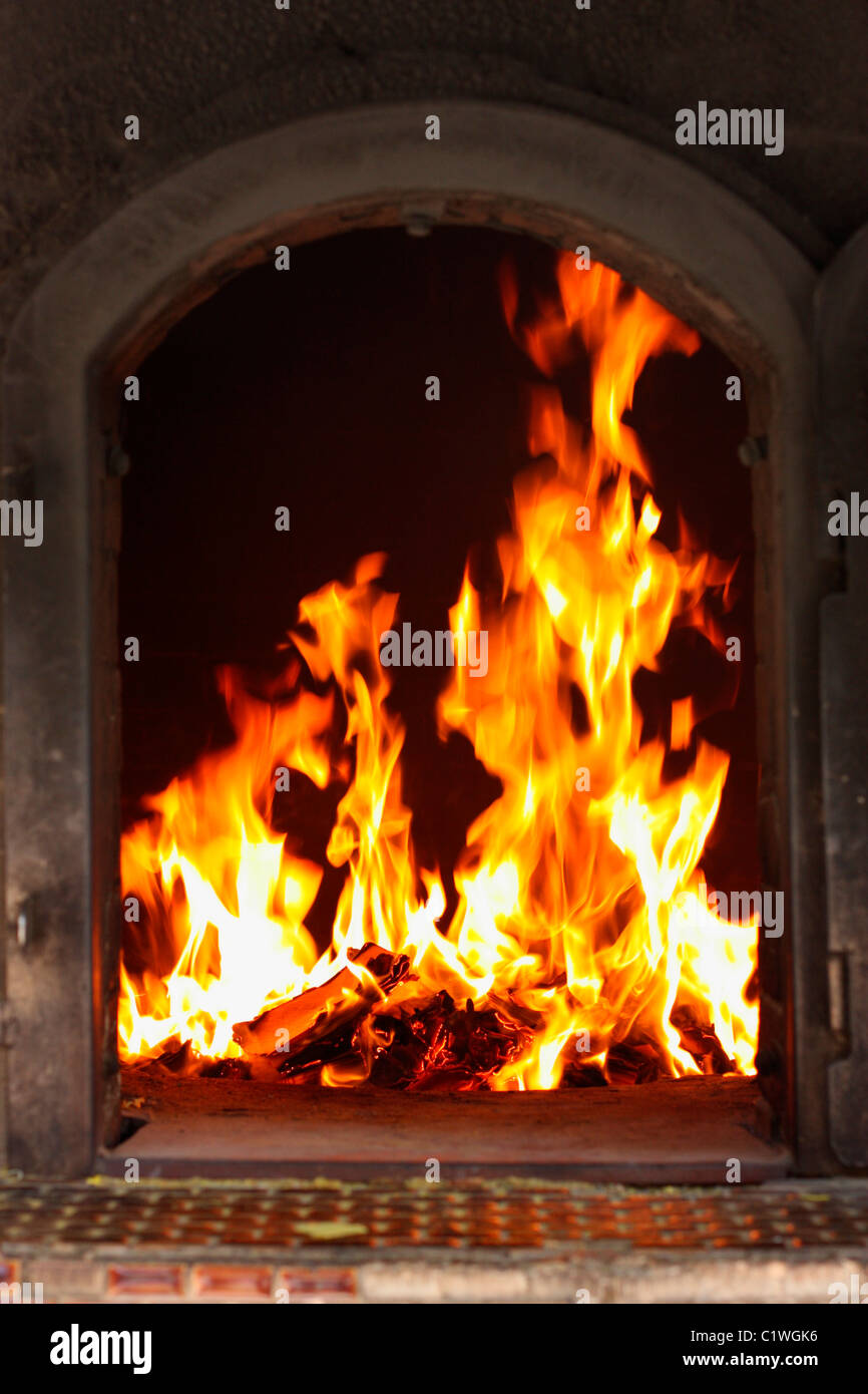 Ghost money burning as an offering to gods at a temple, Tainan, Taiwan ...