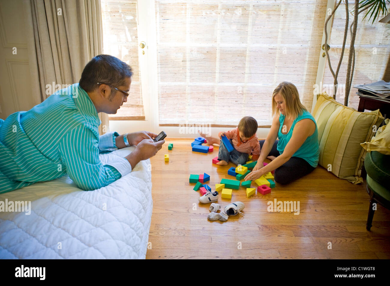 Family at home Stock Photo - Alamy