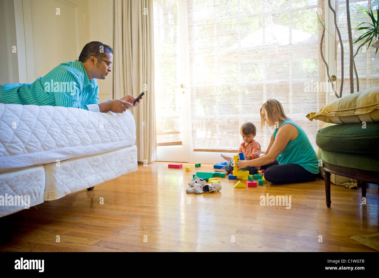 Family at home Stock Photo - Alamy