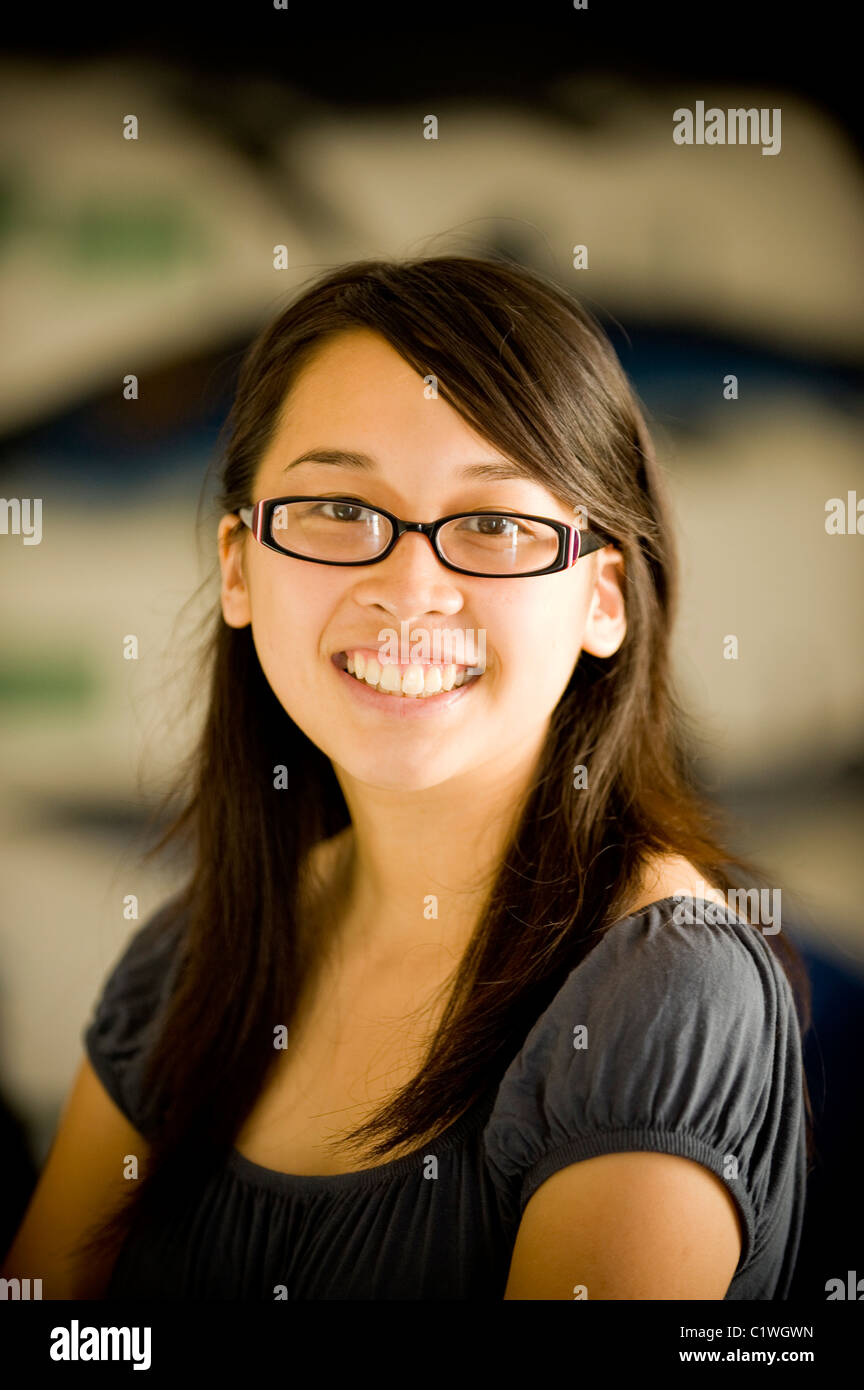 Portrait of a female biology student smiling Stock Photo - Alamy