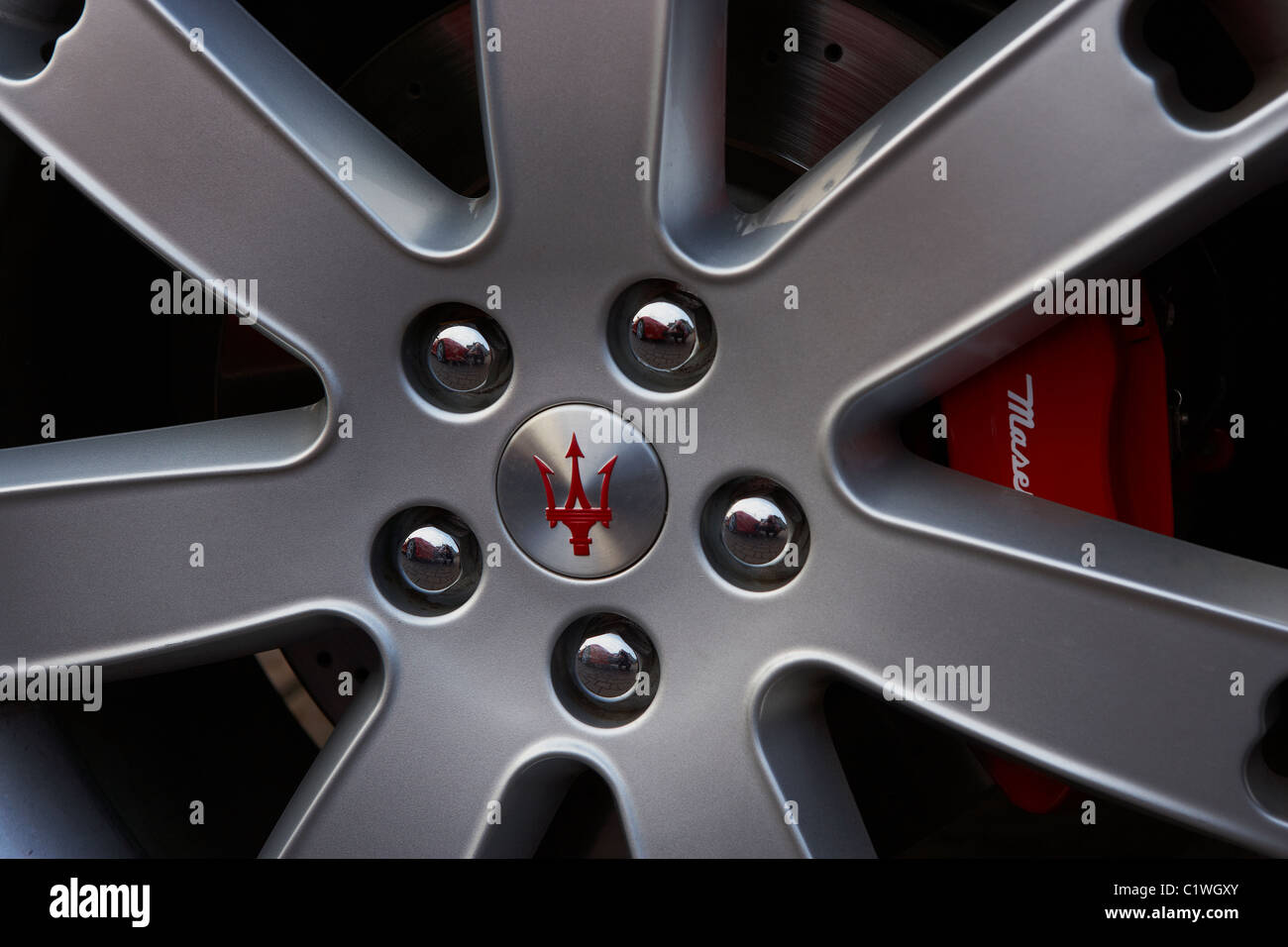 MASERATI SPORTS CAR BADGE ON WHEEL Stock Photo - Alamy