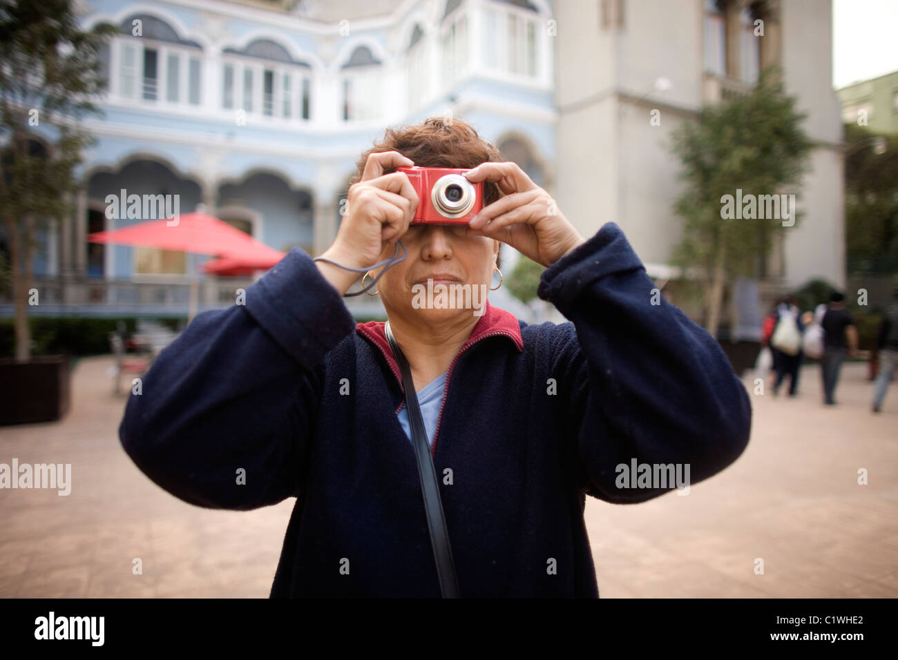 A blind student takes pictures during a photography workshop for the ...