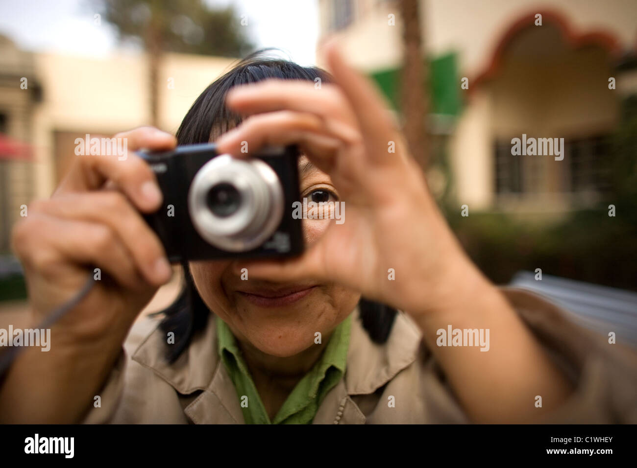 A blind student takes pictures during a photography workshop for the ...