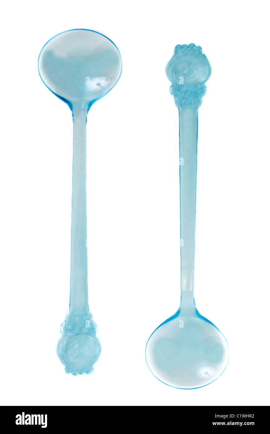 Two blue transparent plastic spoons on white background Stock Photo - Alamy