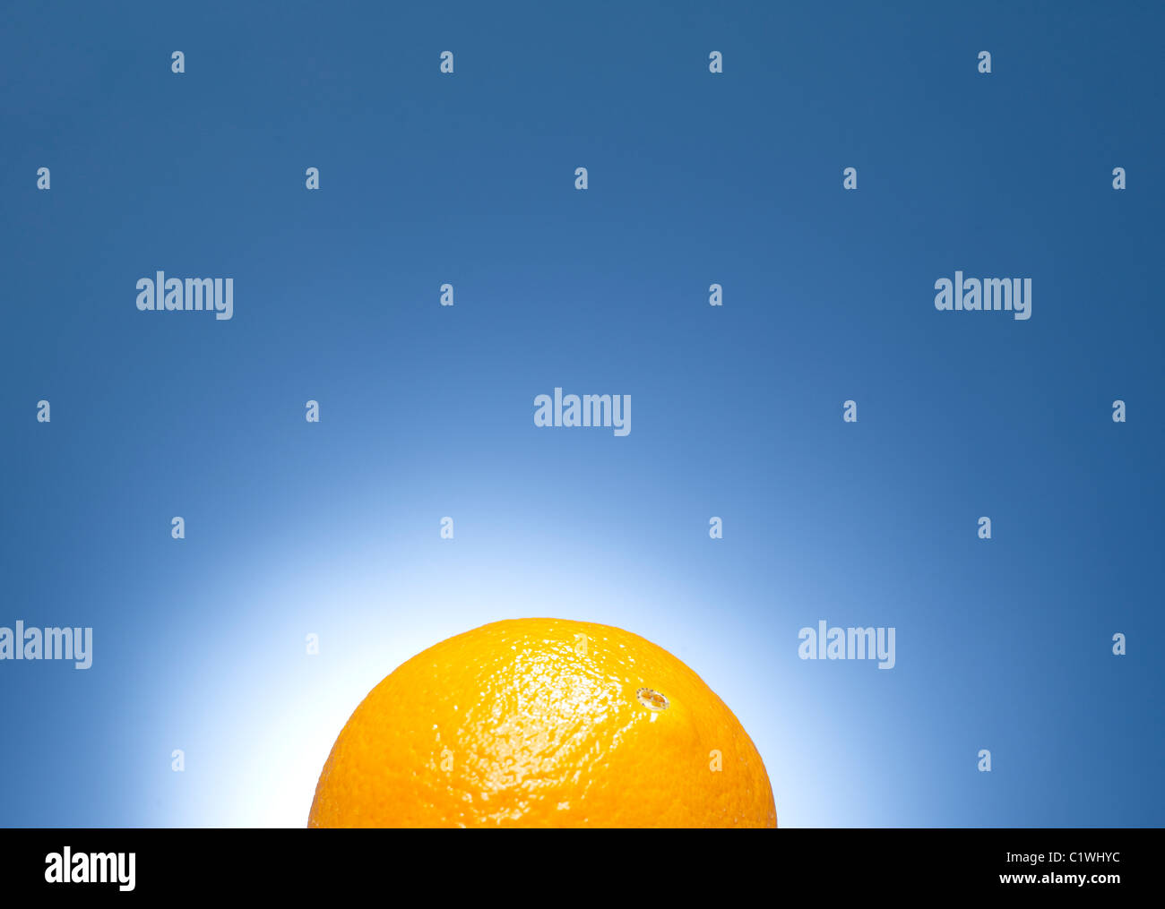 Orange looking like a rising sun Stock Photo - Alamy