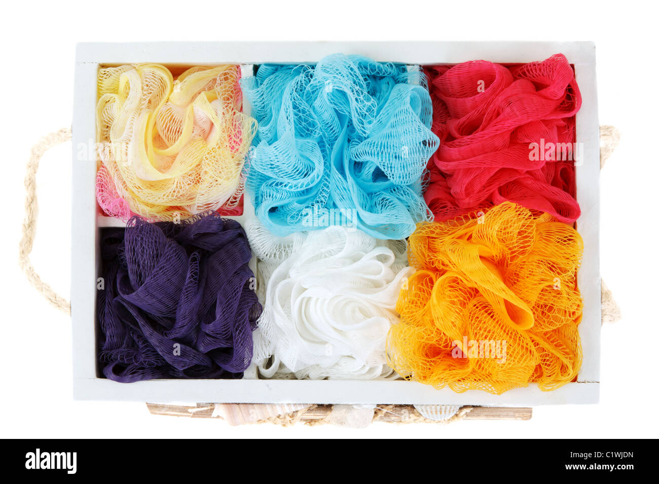 Wooden box and colour sponges on white background Stock Photo - Alamy