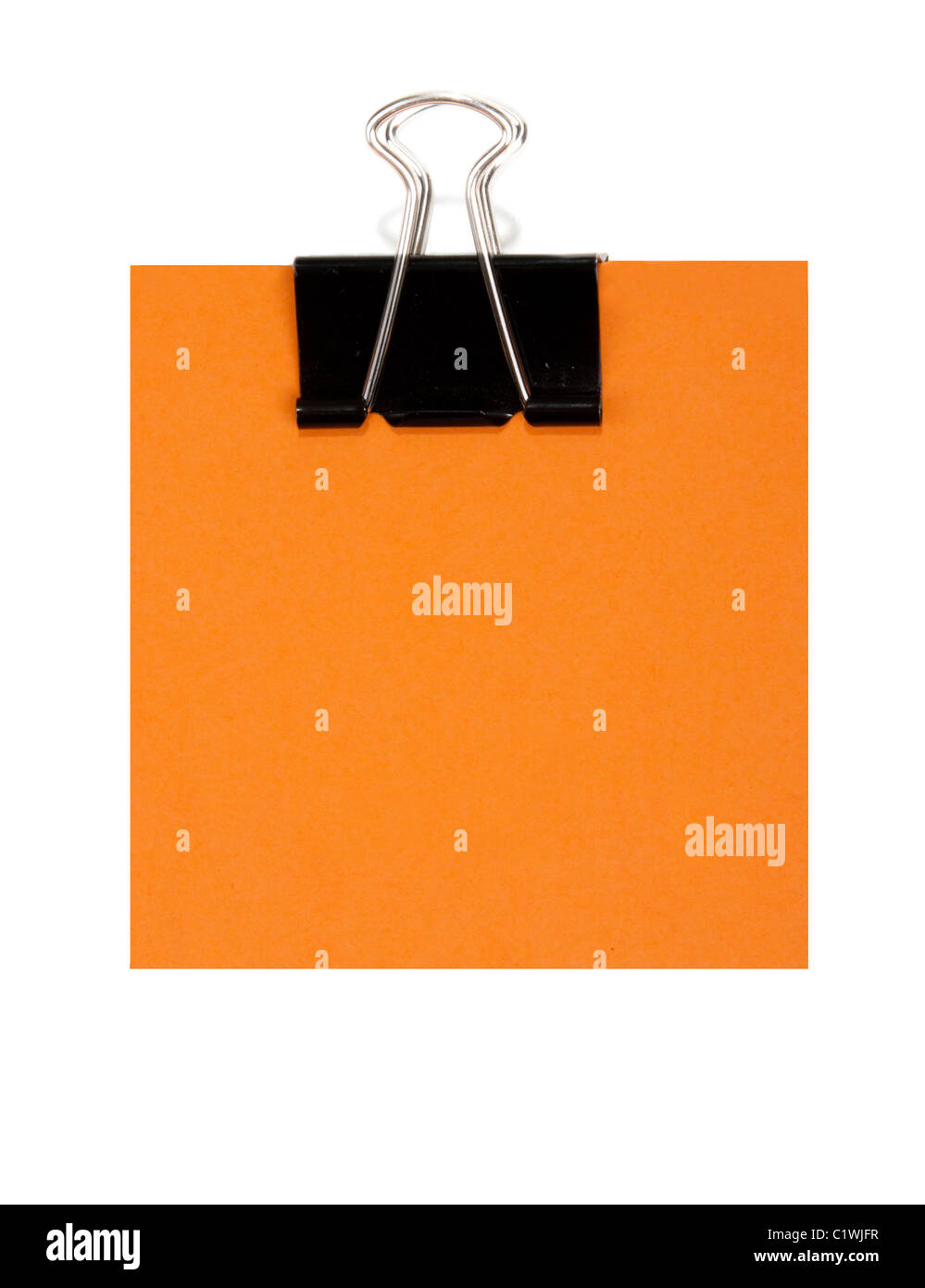 Orange note and black staple on white background Stock Photo - Alamy