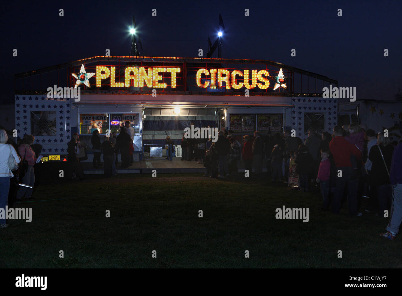 Ticket booth at night time at the circus Stock Photo - Alamy