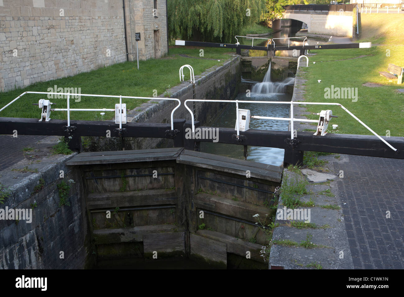 Canal locks closed showing pound at low position filling. Bath, England ...