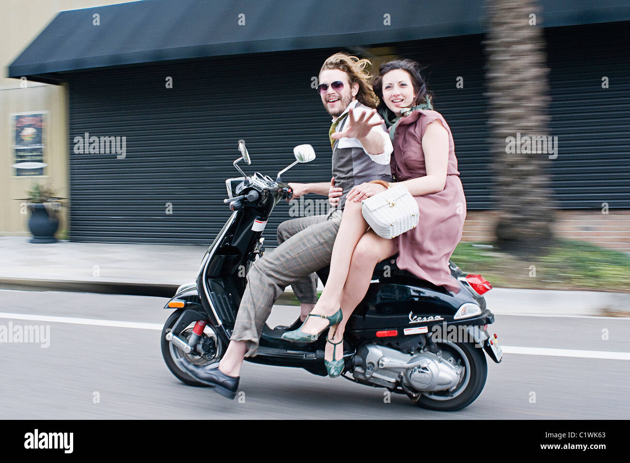 Man riding a motorized scooter hi-res stock photography and images - Alamy