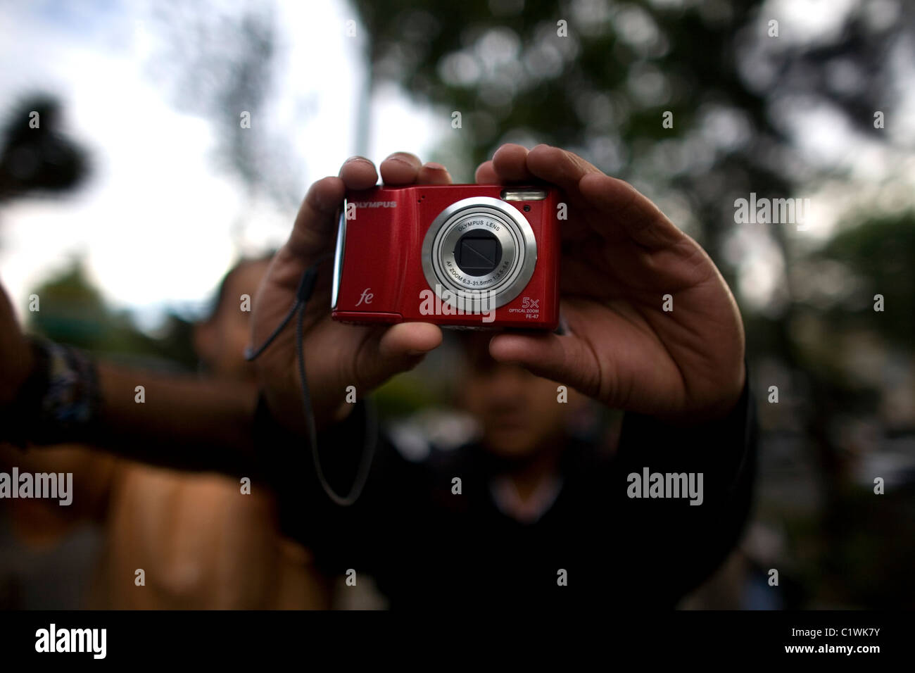 A blind photographer takes pictures during a photography workshop for ...