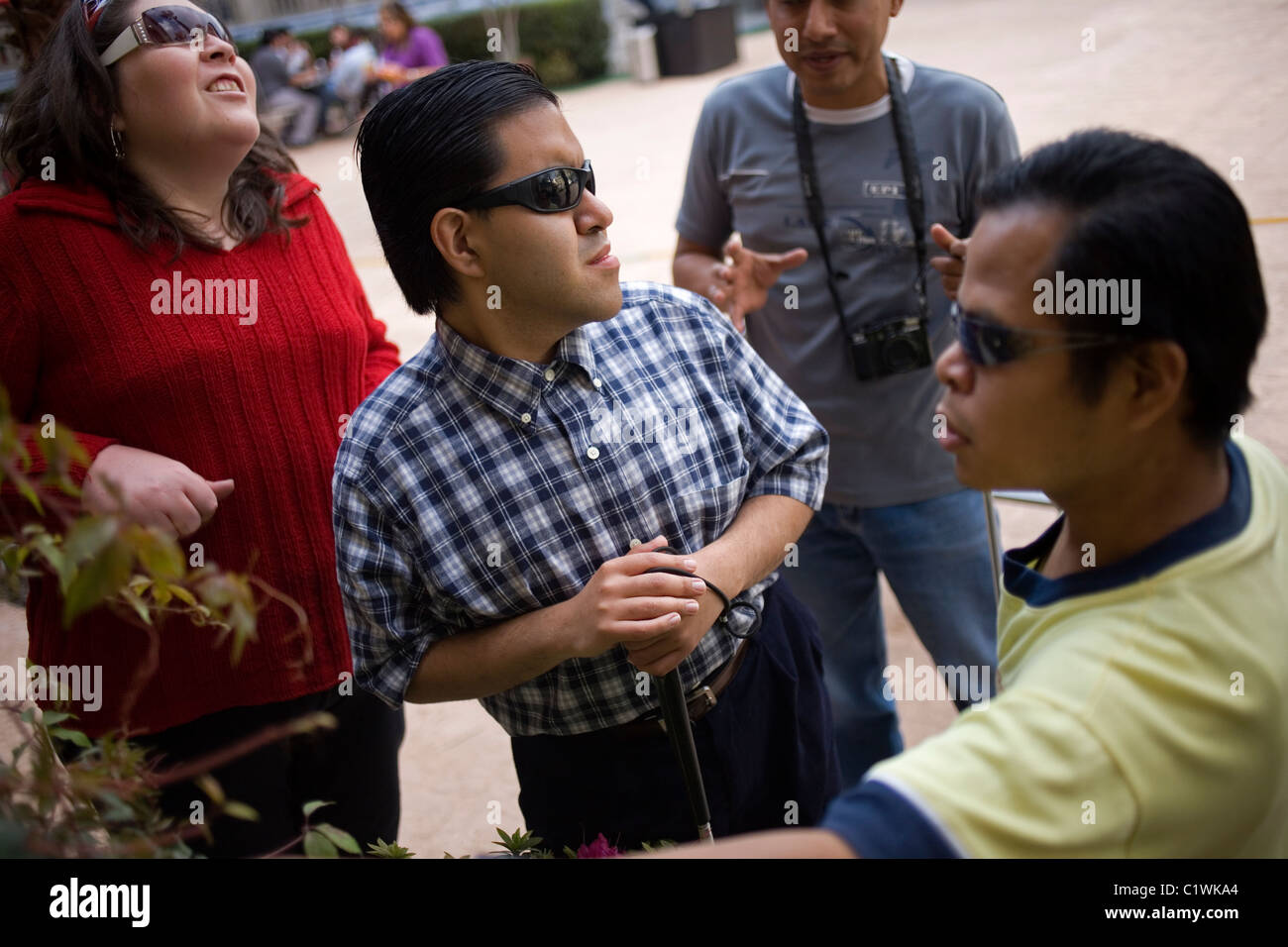 Blind students listen a photography teacher during a photography ...