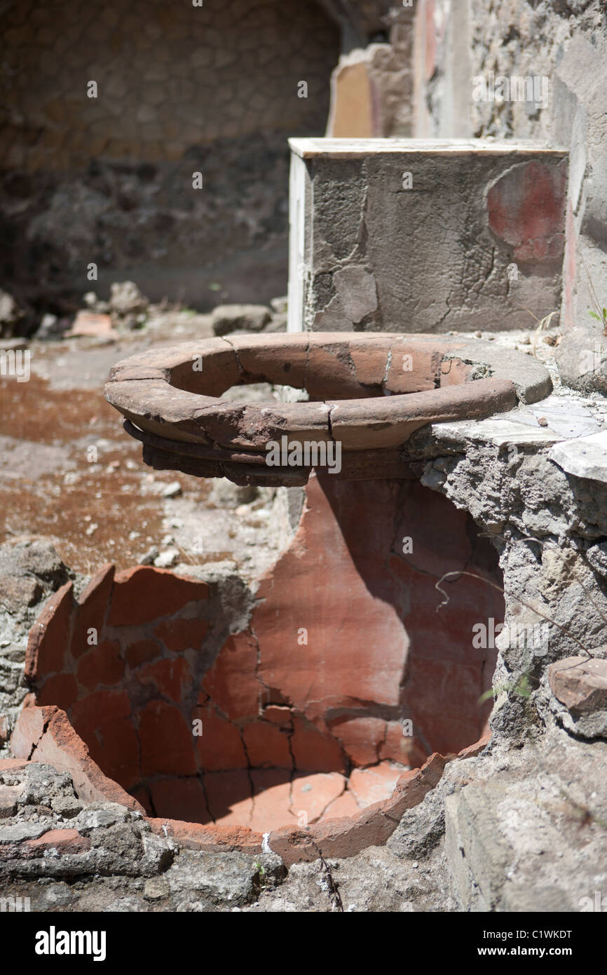 Globular storage jar embedded in countertop of ancient Roman retail ...