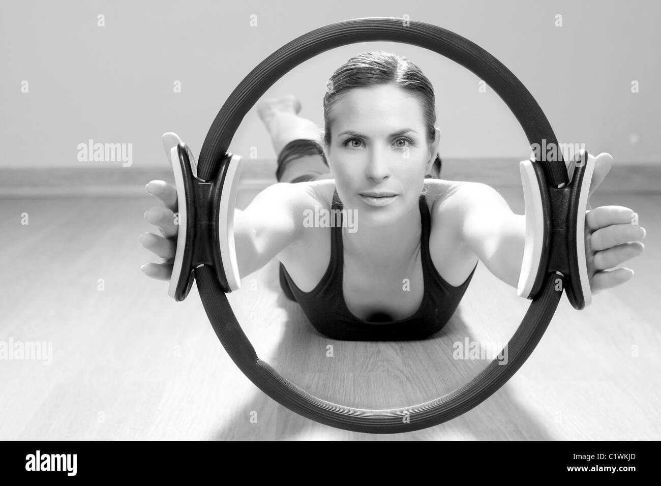 magic pilates ring woman aerobics sport gym exercises on wooden floor ...