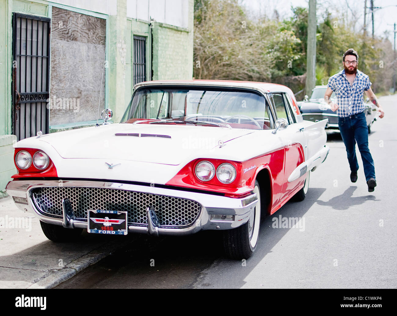Man running towards a car Stock Photo - Alamy