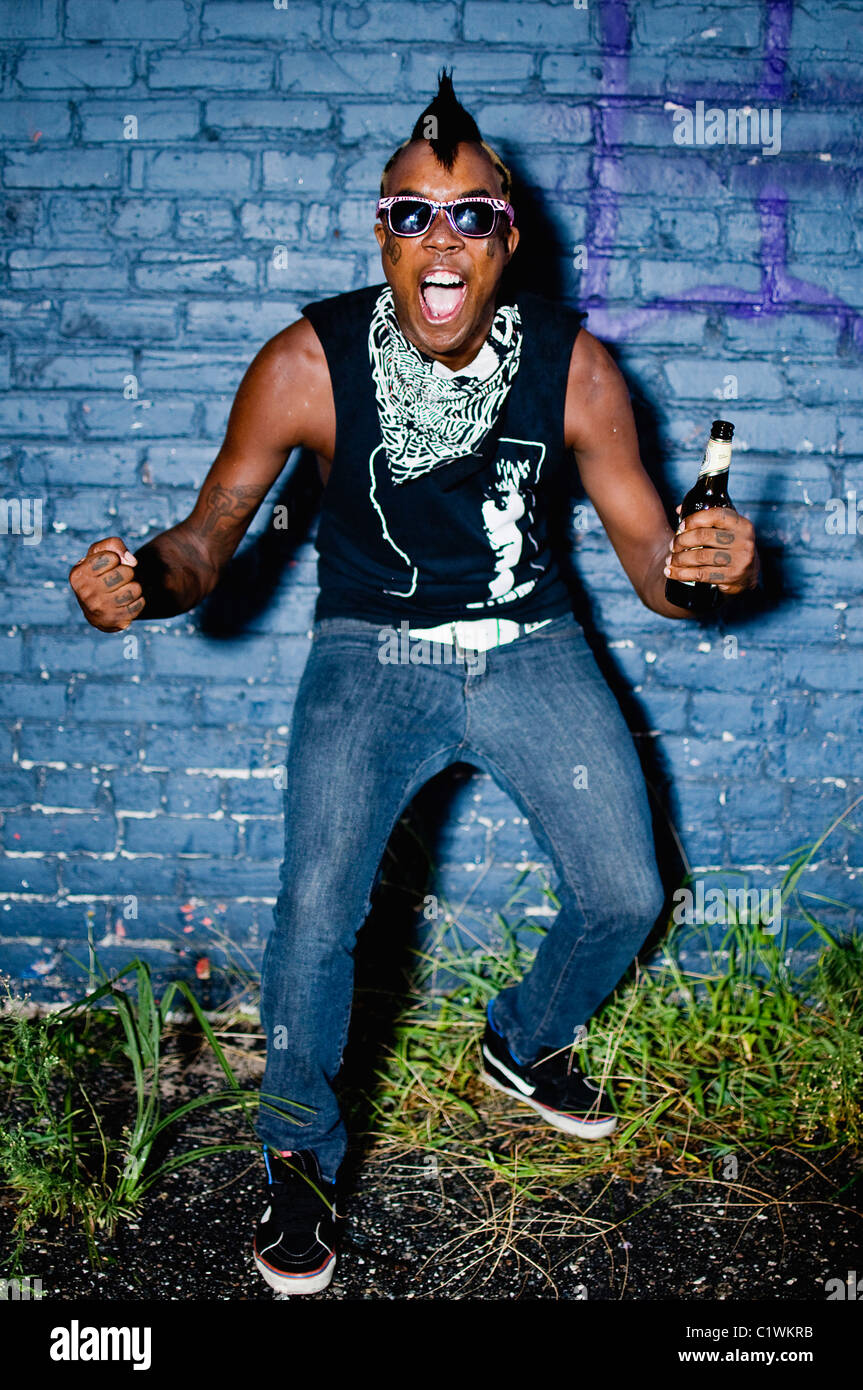 Man shouting with a beer bottle Stock Photo - Alamy