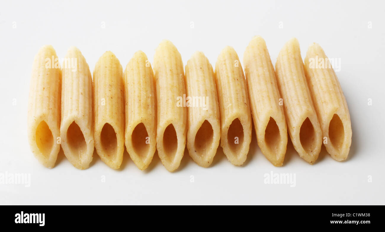Whole wheat pasta tubes - studio shot Stock Photo - Alamy
