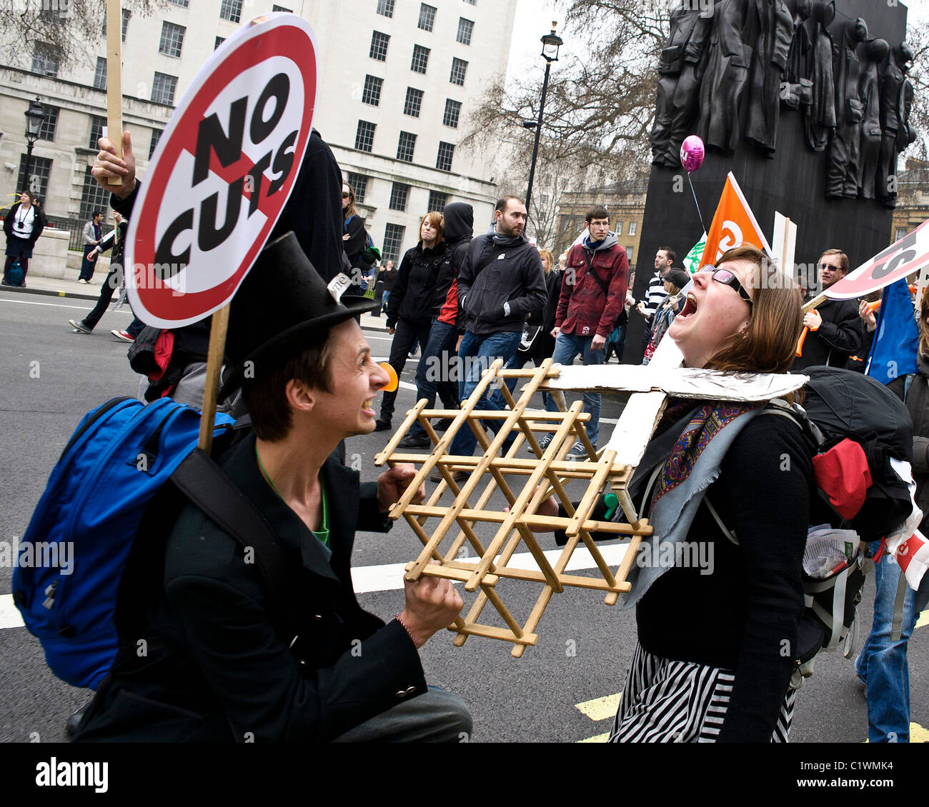 26/03/2011. A couple play act with extending scissors on The March for ...