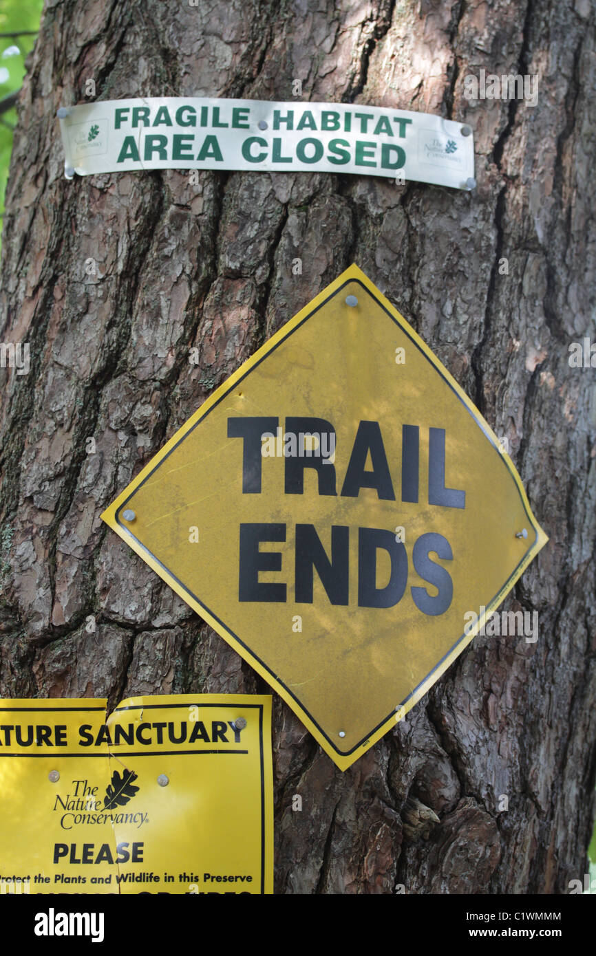 Signs reading "Trail Ends" and "Area Closed" mark the end of a trail in ...
