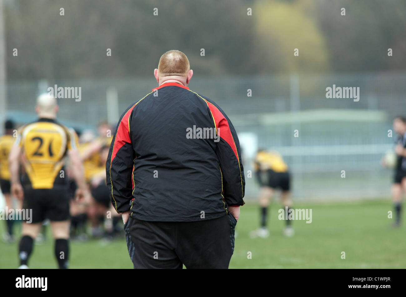 rugby coach watching a match from the touchline Stock Photo - Alamy