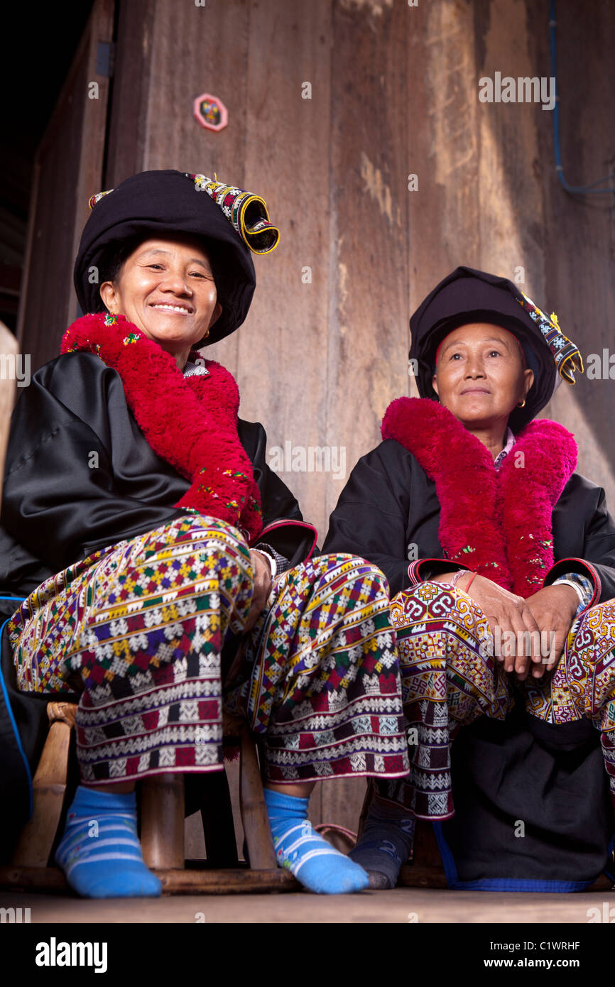 Iu Mien(Yao) hill tribes old woman siting down visit her relative ...