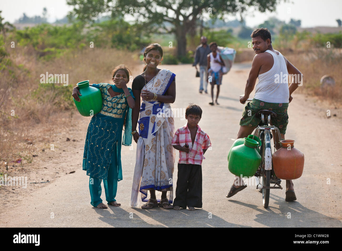 people carrying jars Andhra Pradesh South India Stock Photo - Alamy