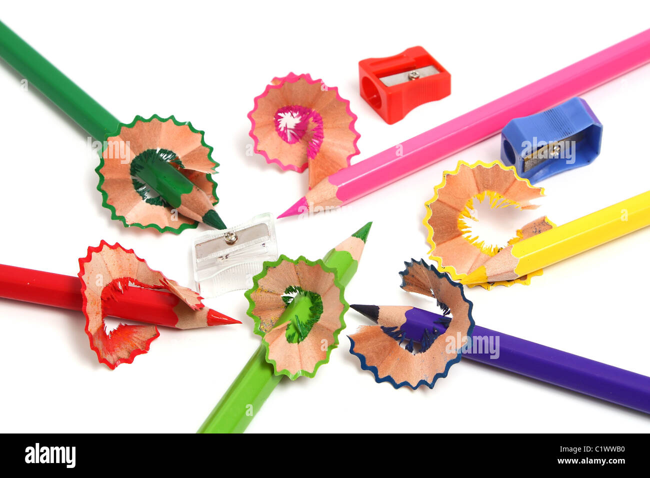 colors sharp pencils sharpener and shaving isolated on white background ...