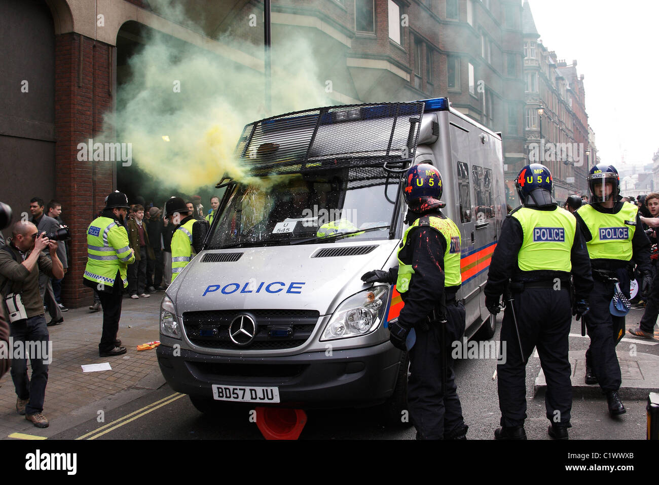 Police van attacked by rioters in London Stock Photo - Alamy