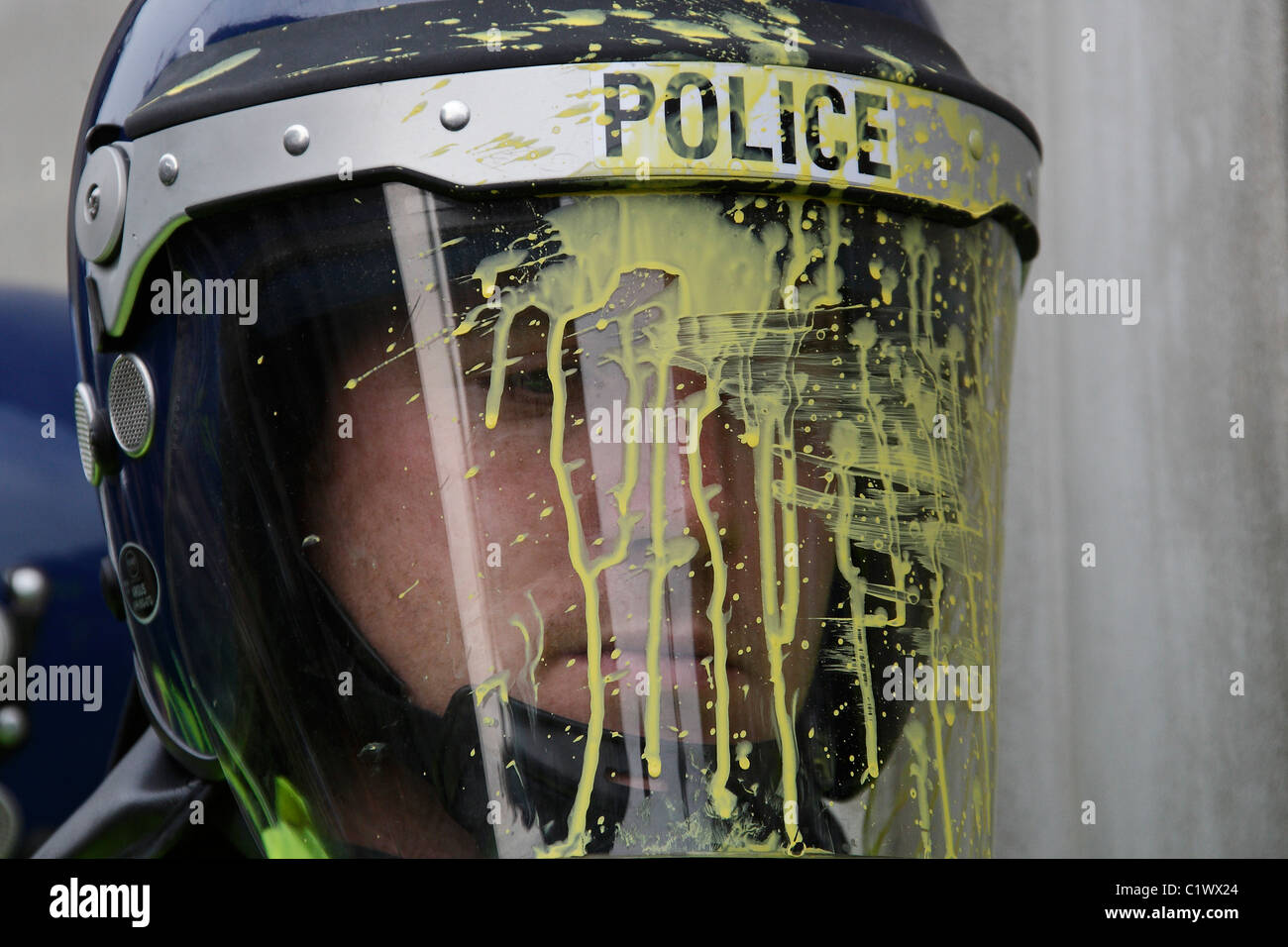 Paint bombed riot police Stock Photo - Alamy