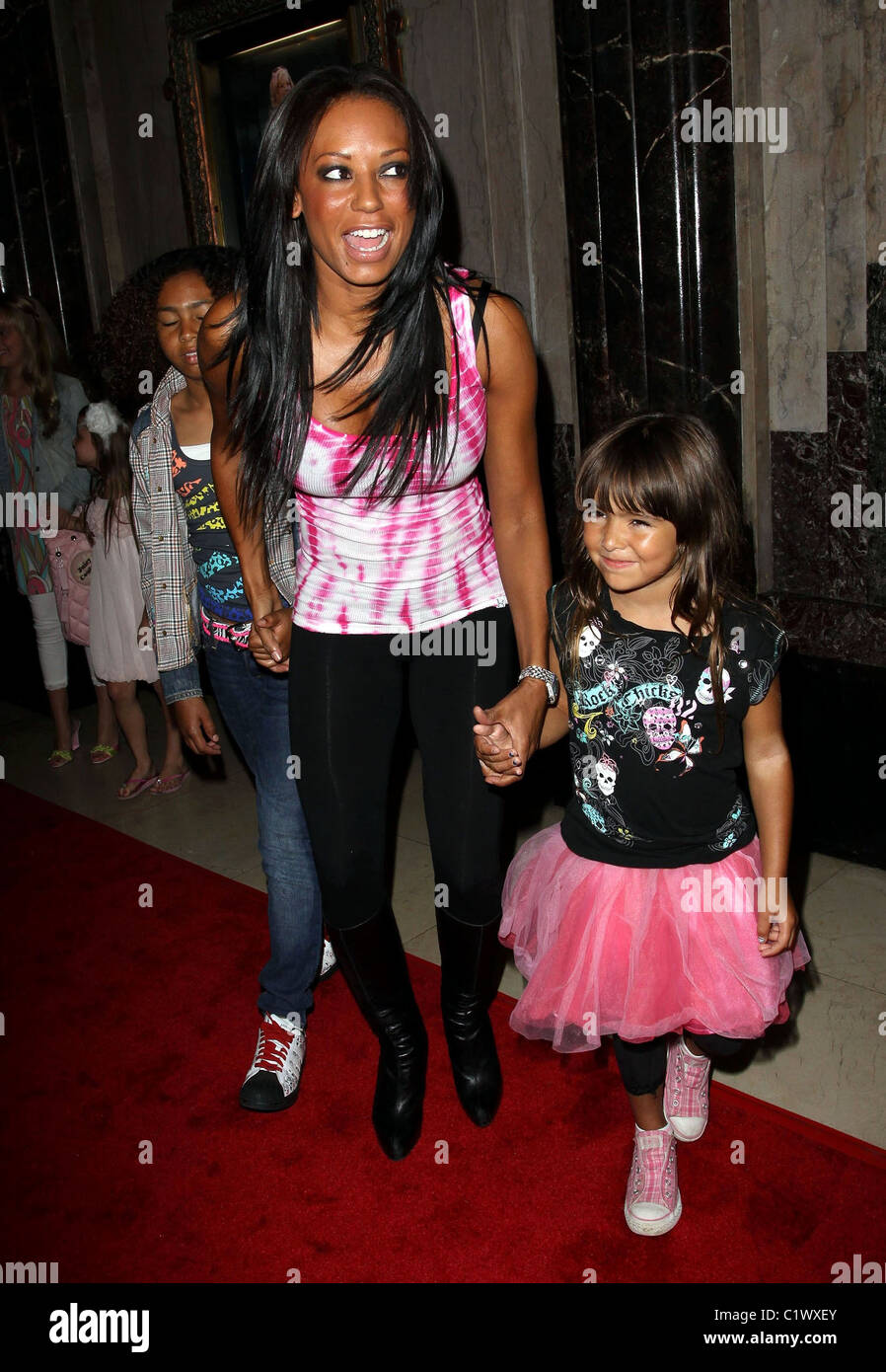 Melanie Brown with her daughters Phoenix Chi and Angel Iris The opening ...