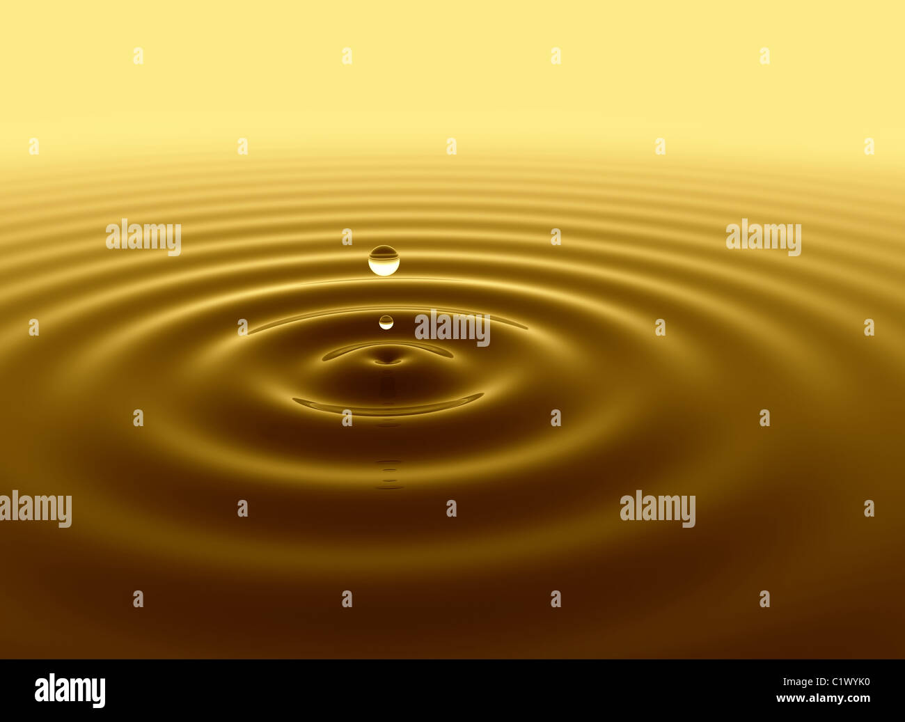 Golden drop - water and ripples in golden orange color Stock Photo - Alamy