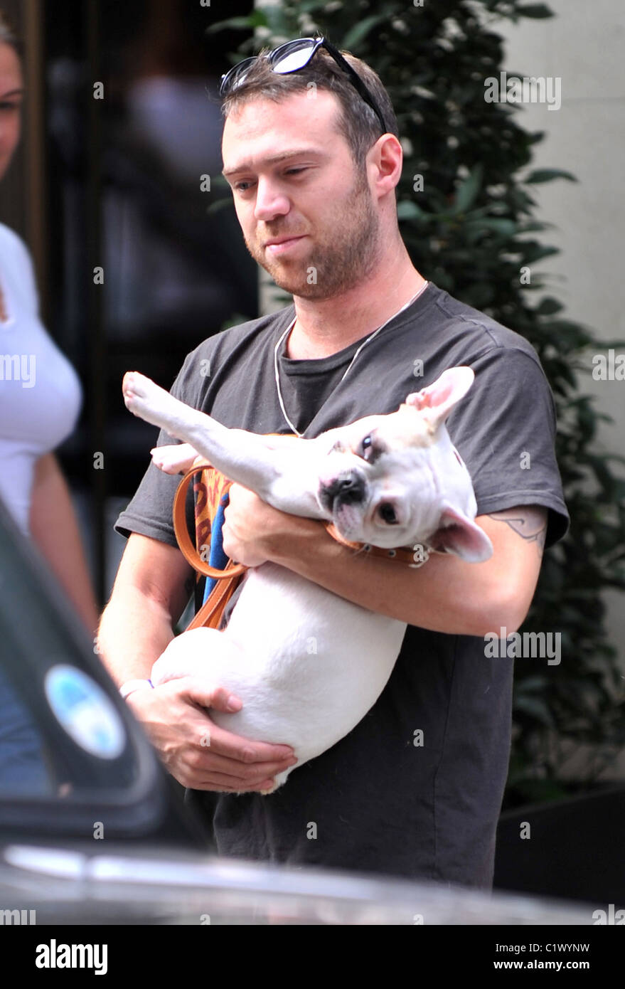 Tom Crane leaves his hotel with girlfriend Sarah Harding's dog Corker ...