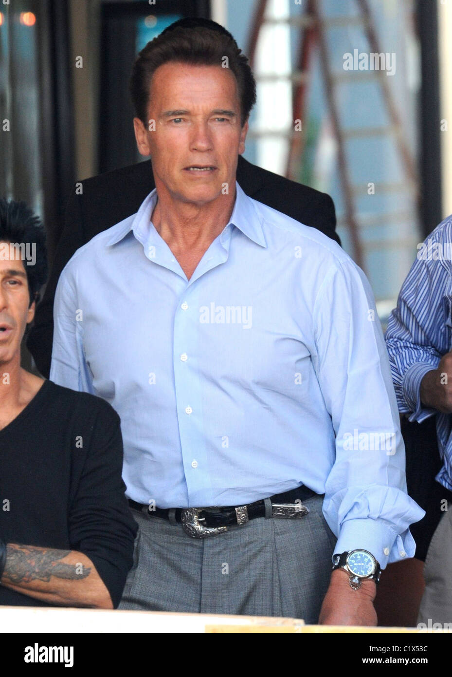 Governor of California Arnold Schwarzenegger makes his way home after ...