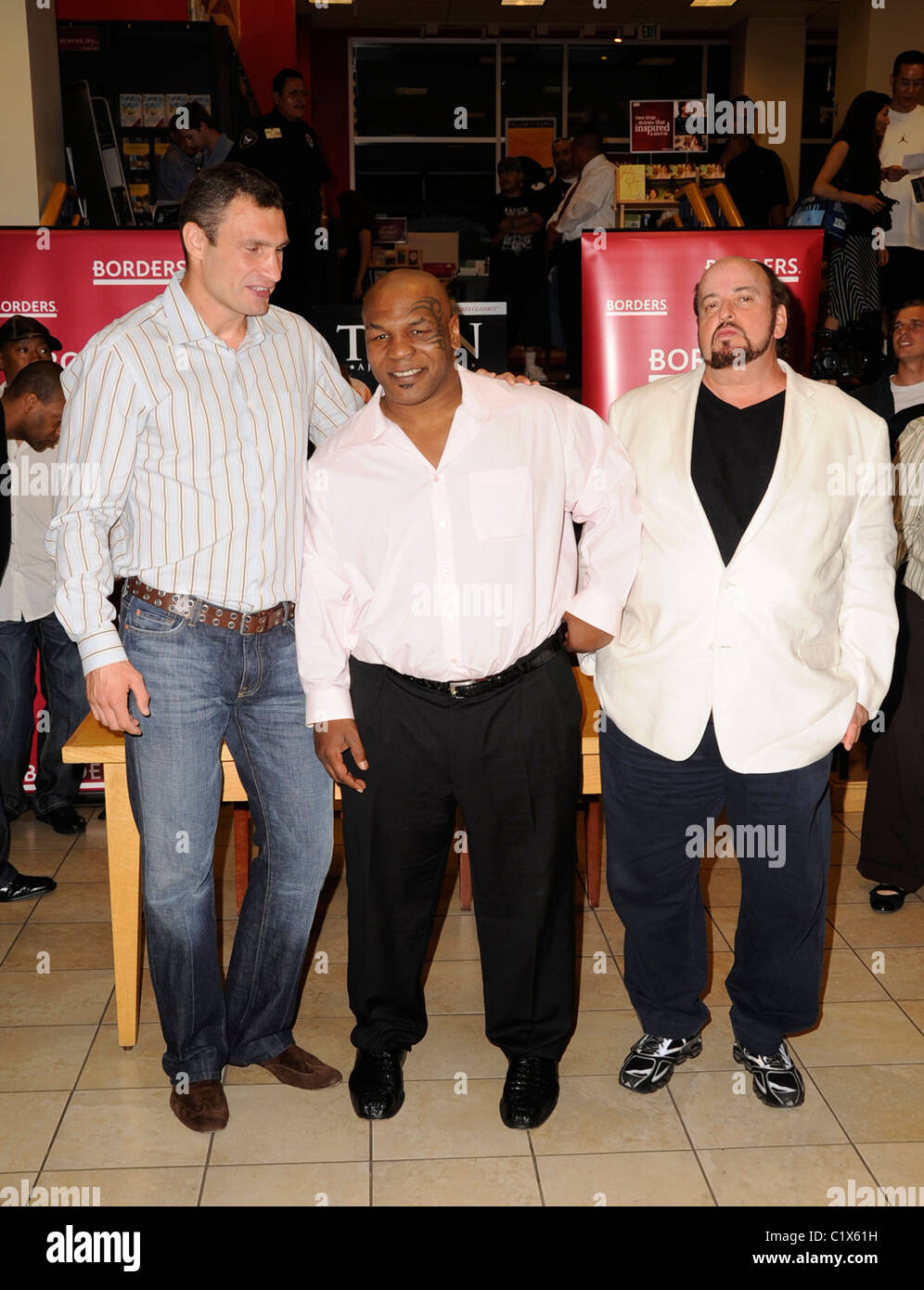 Vitali Klitschko, Mike Tyson and Director James Toback signing copies ...