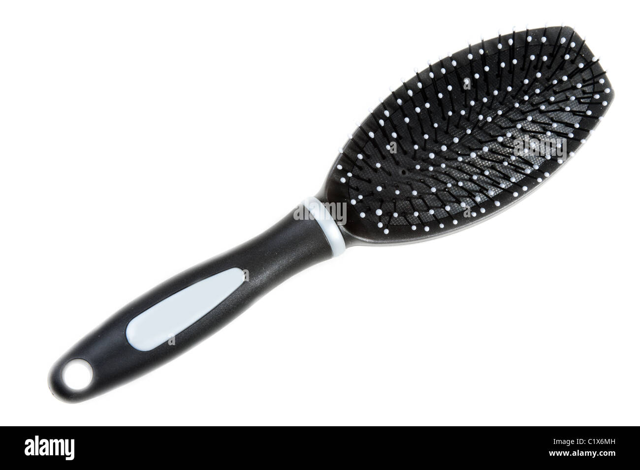 Black massage plastic comb on white background Stock Photo - Alamy