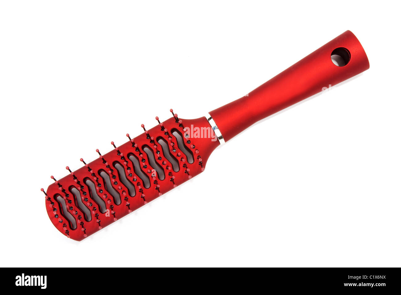 Red massage plastic comb on white background Stock Photo - Alamy