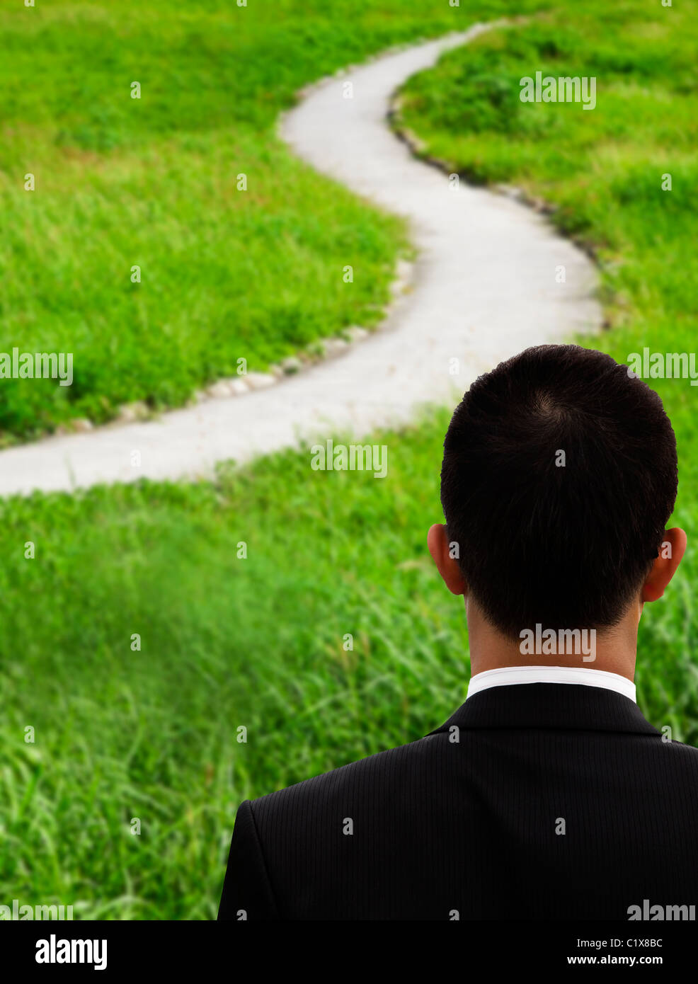 Business man thinking and watching the curved road Stock Photo - Alamy
