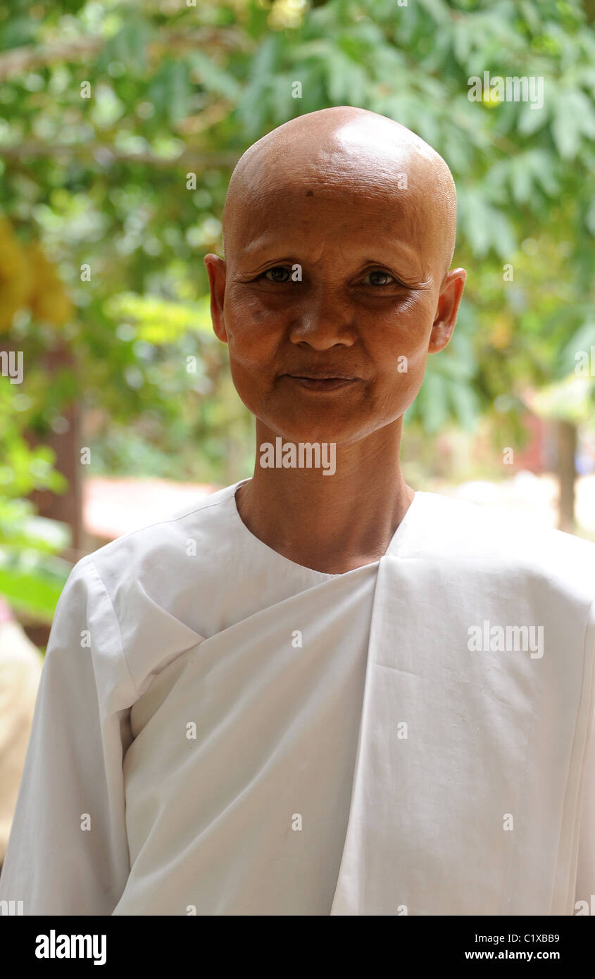 Buddhist nun poses for picture in the grounds of an isolated nunnery in ...