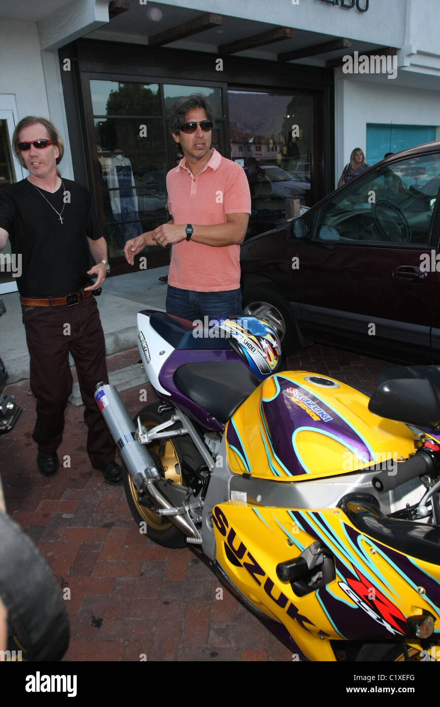 Ray Romano talks to a fan about his motorcycle as he leaves Nobu ...