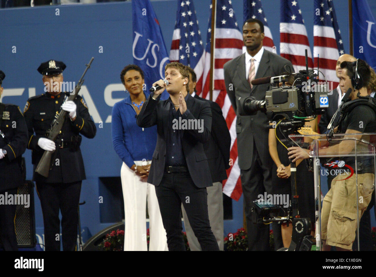 Rob Thomas sings the National Anthem at the opening ceremony of the ...