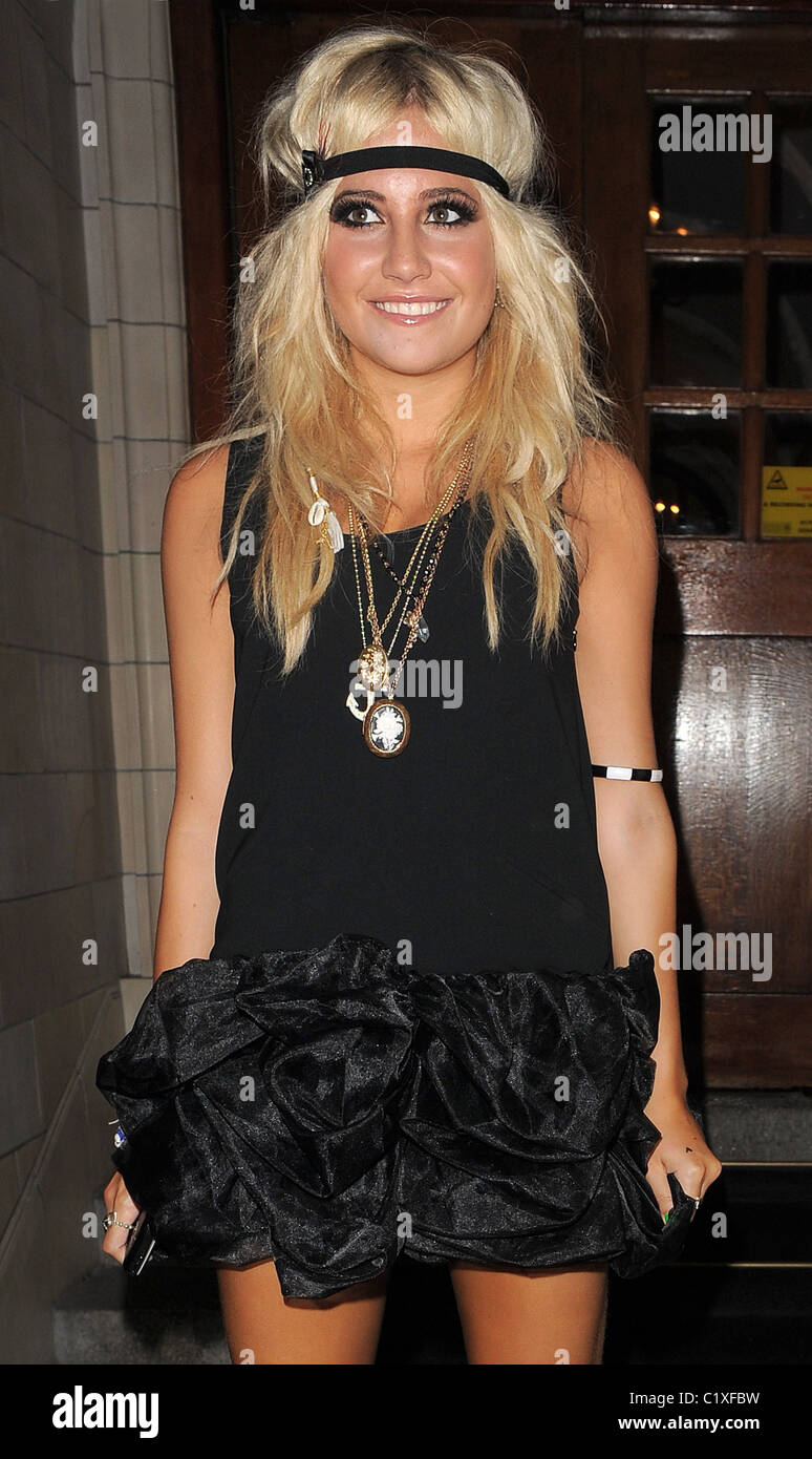 Pixie Lott poses for the cameras as she arrives back at her hotel after ...