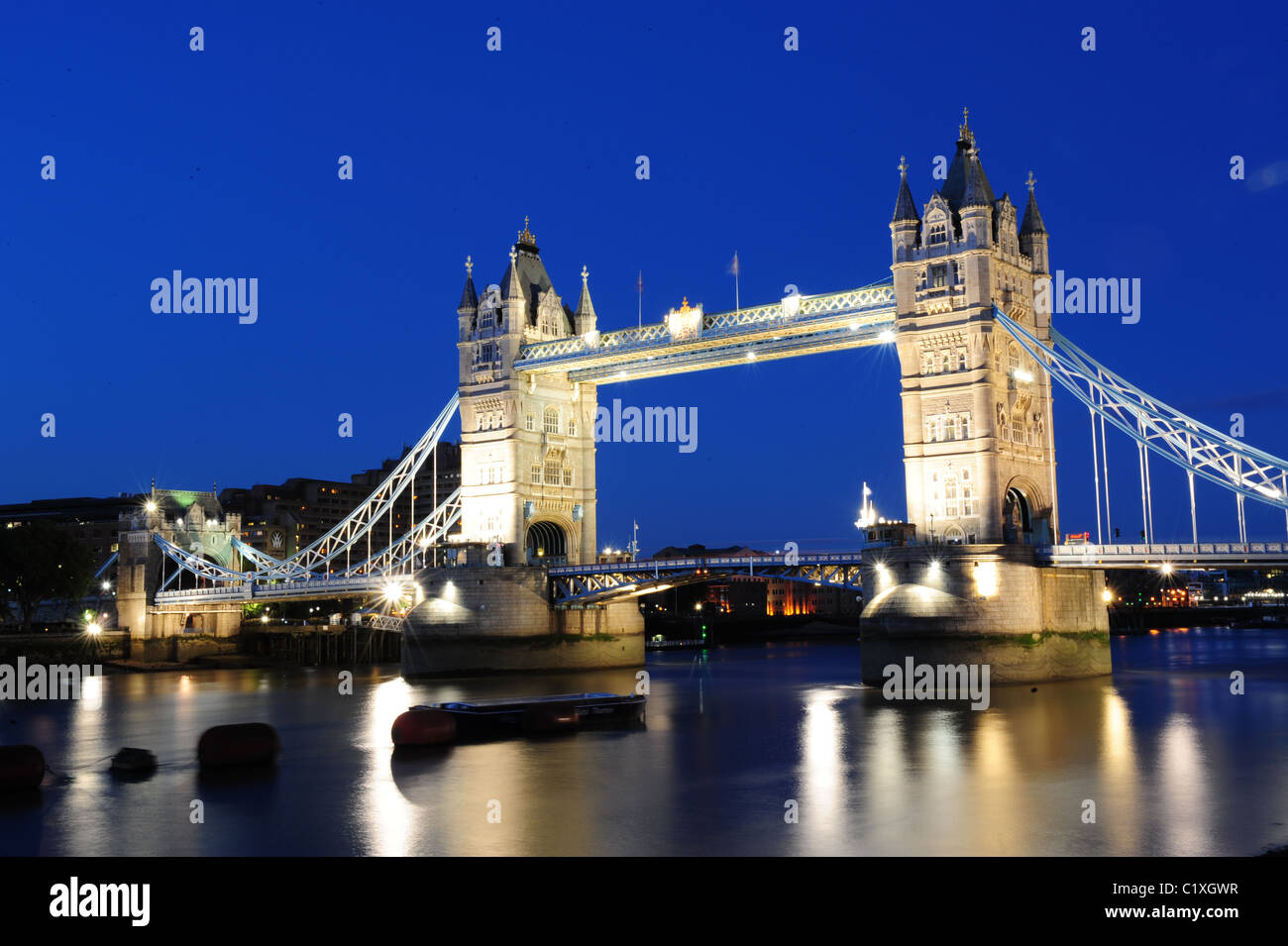 Tower Bridge and reflection of Tower Bridge in river Thames in London ...